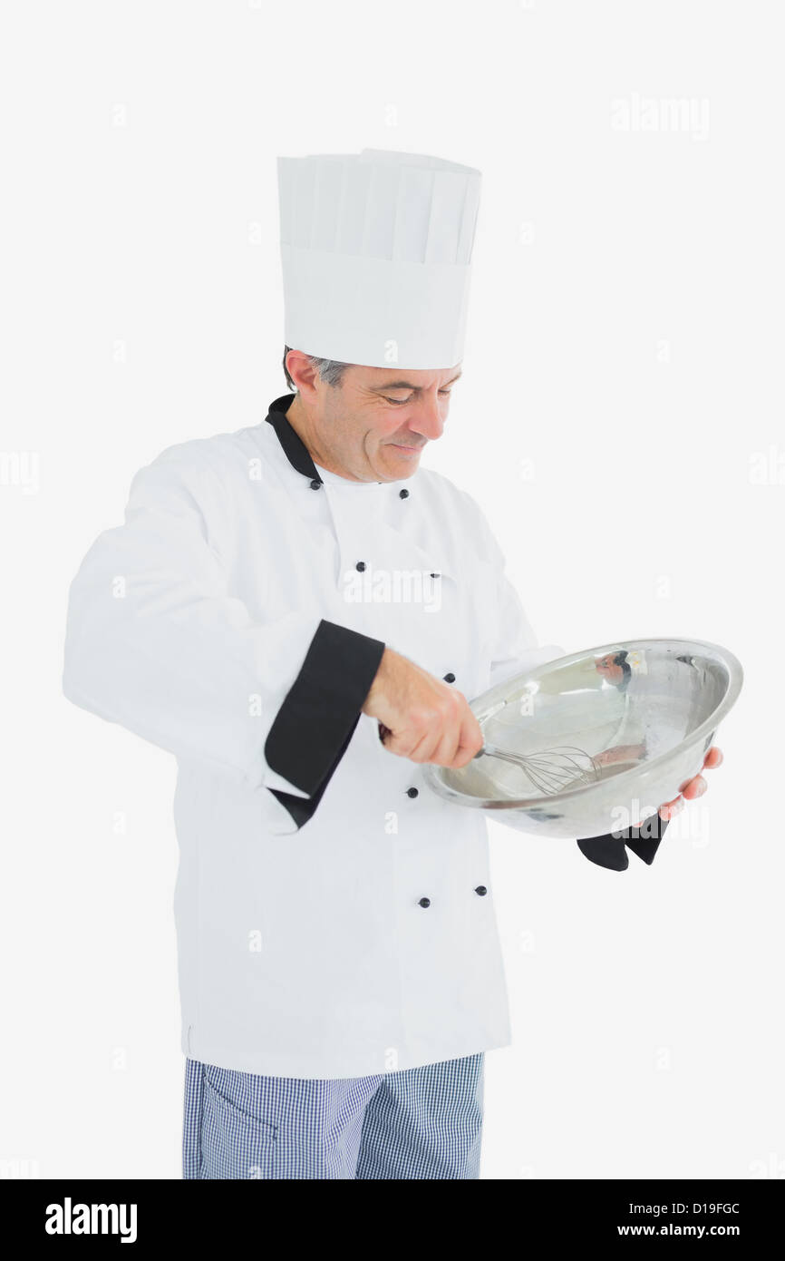 Chef using whisk and mixing bowl Stock Photo - Alamy