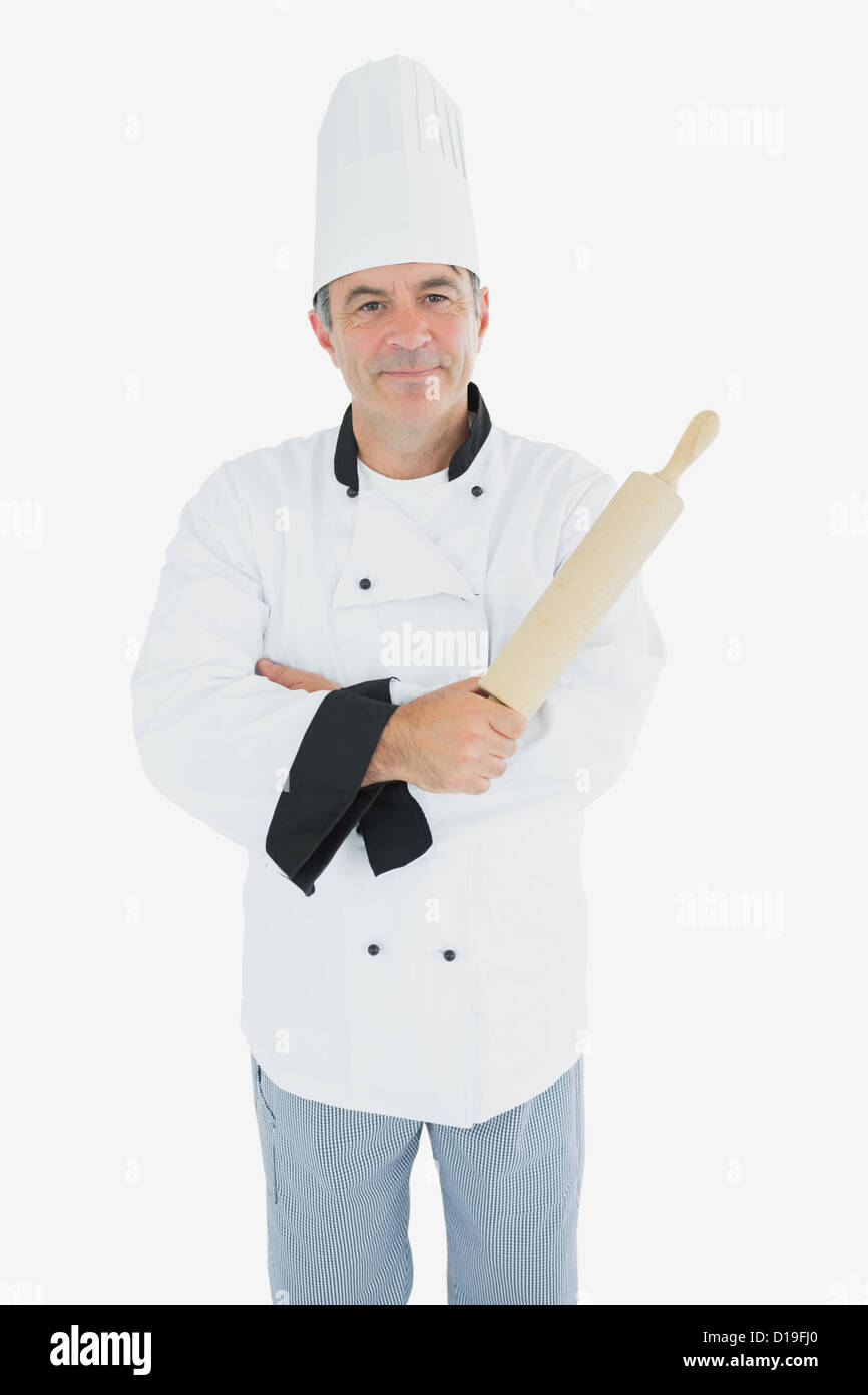 Male chef holding rolling pin Stock Photo - Alamy
