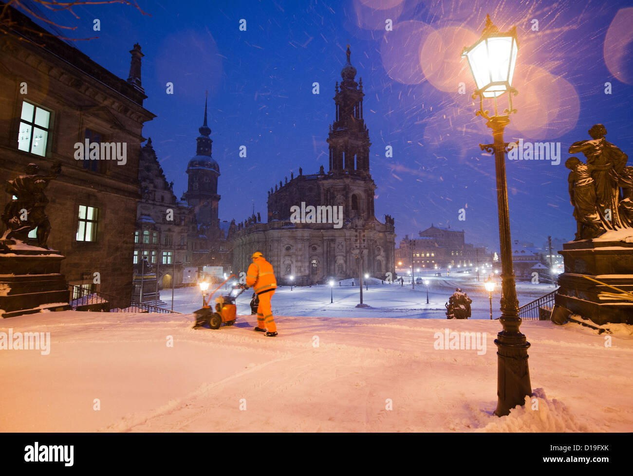 Workers clear a huge staircase of snow in Dresden, Germany, 11 December ...