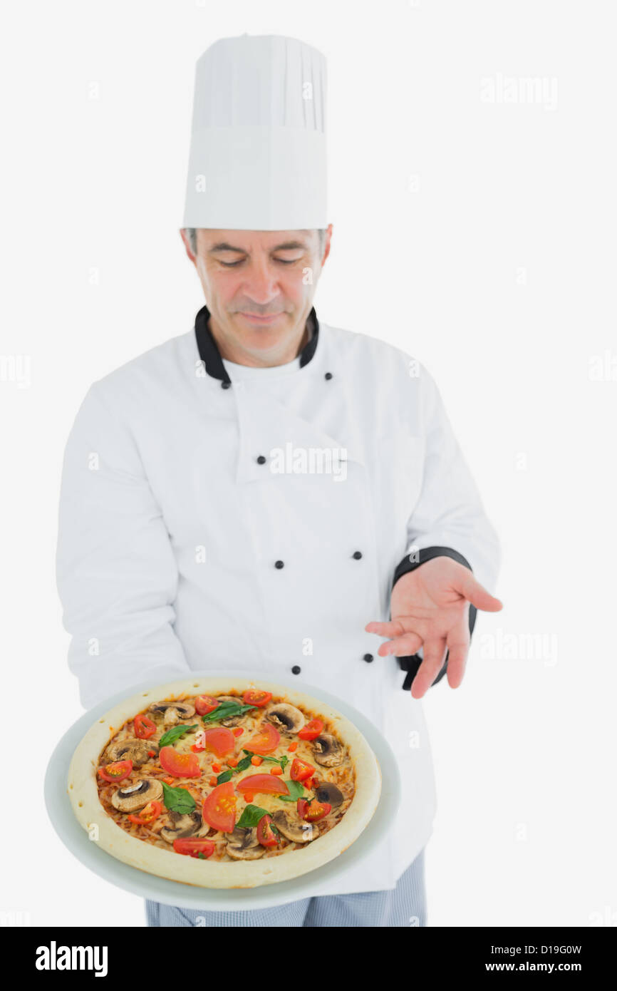 Male chef holding pizza Stock Photo - Alamy