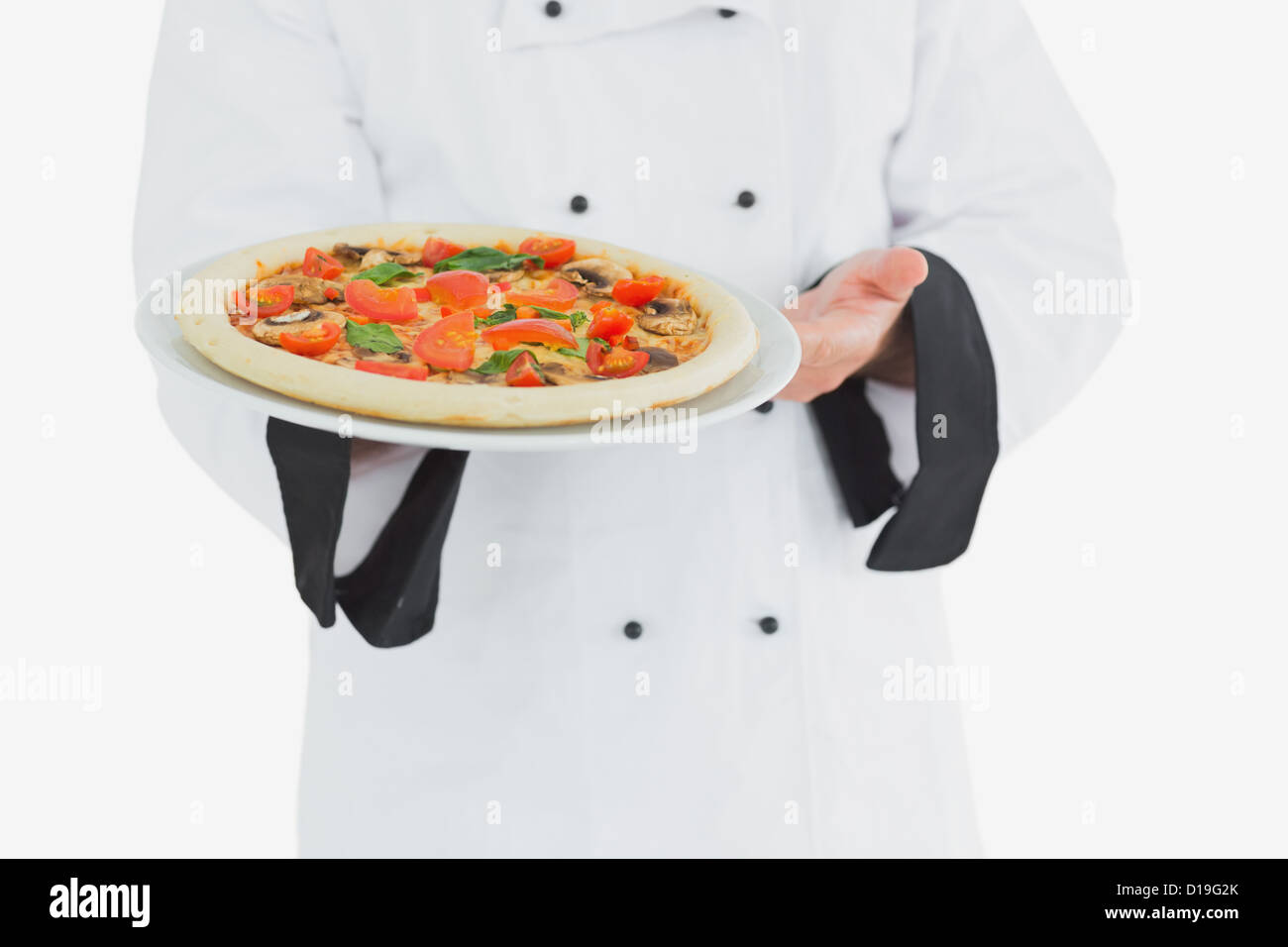 Chef offering pizza Stock Photo - Alamy