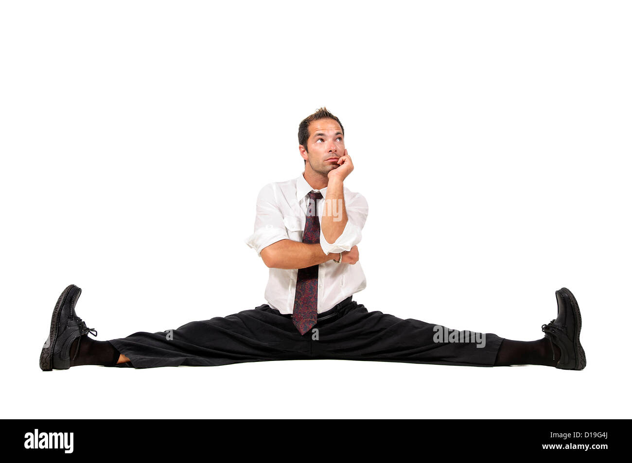 Businessman doing splits on the floor Stock Photo - Alamy