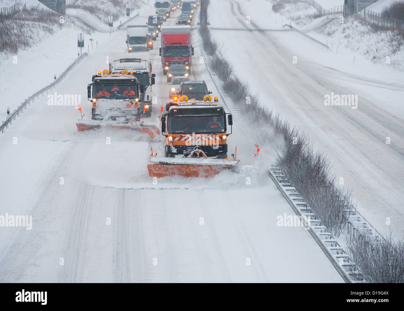 Snow clearing vehichles clear the snow from Autobahn A20 near Pasewalk ...