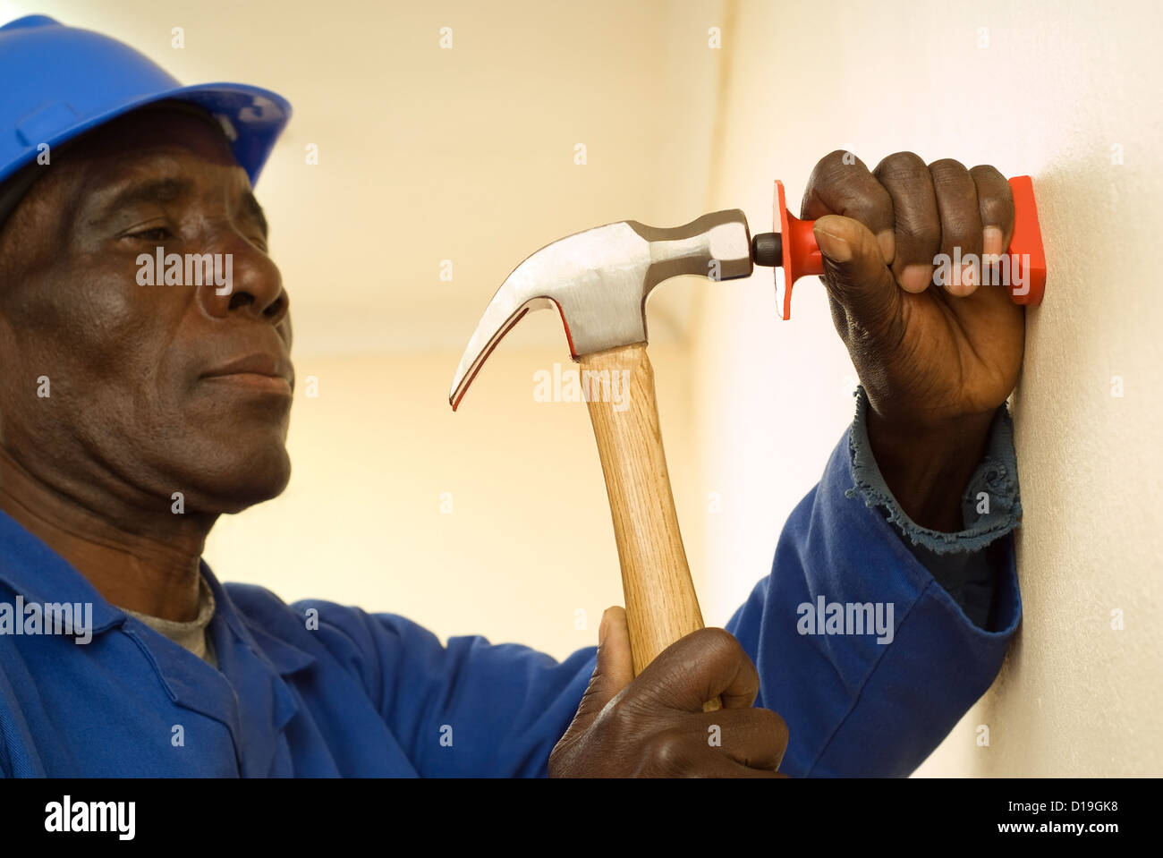 African American Construction Worker Handyman Holding Hammer In