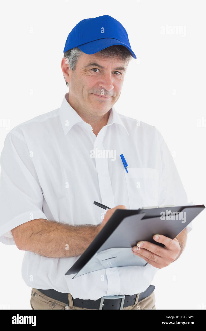 Courier man writing in hi-res stock photography and images - Alamy