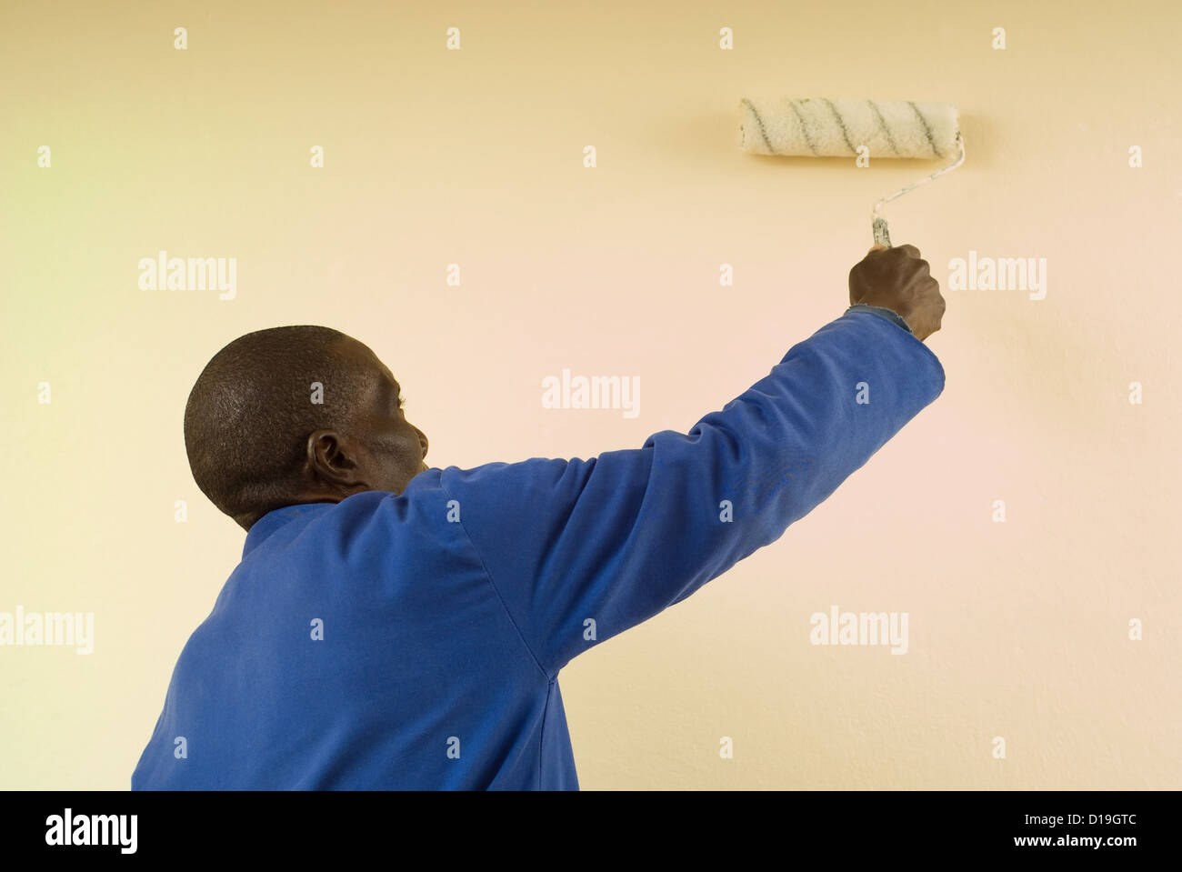 African American Construction Worker Painting a Wall Stock Photo - Alamy