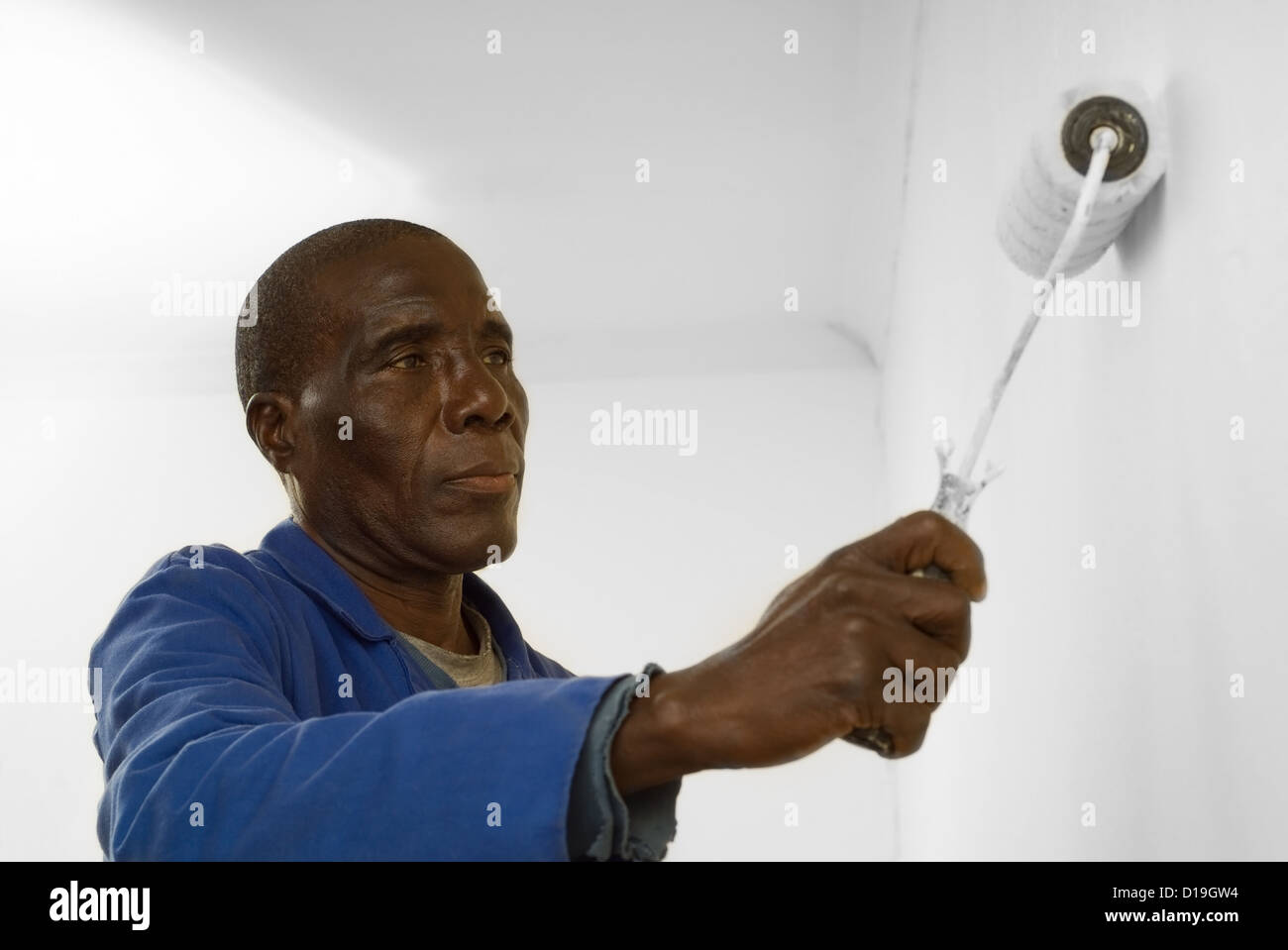 African American Construction Worker Painting a Wall Stock Photo - Alamy
