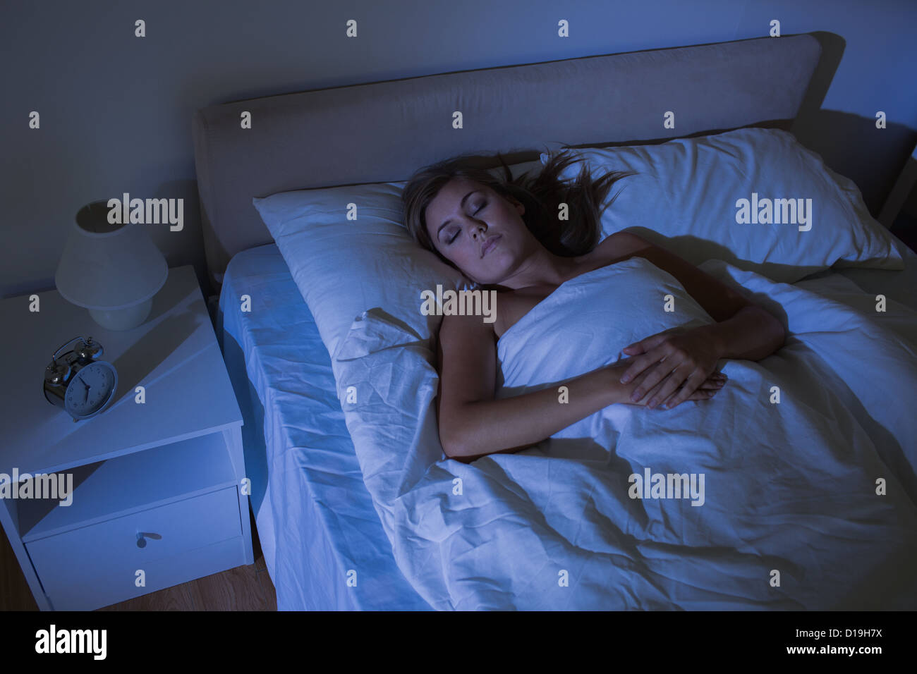 Calm woman sleeping at night Stock Photo - Alamy