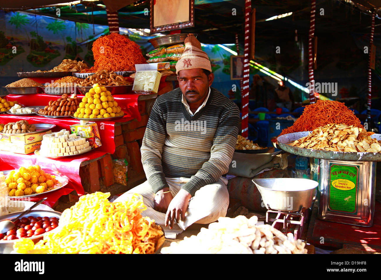 Indian street vendor selling sweets at Pushkar fair Stock Photo ...