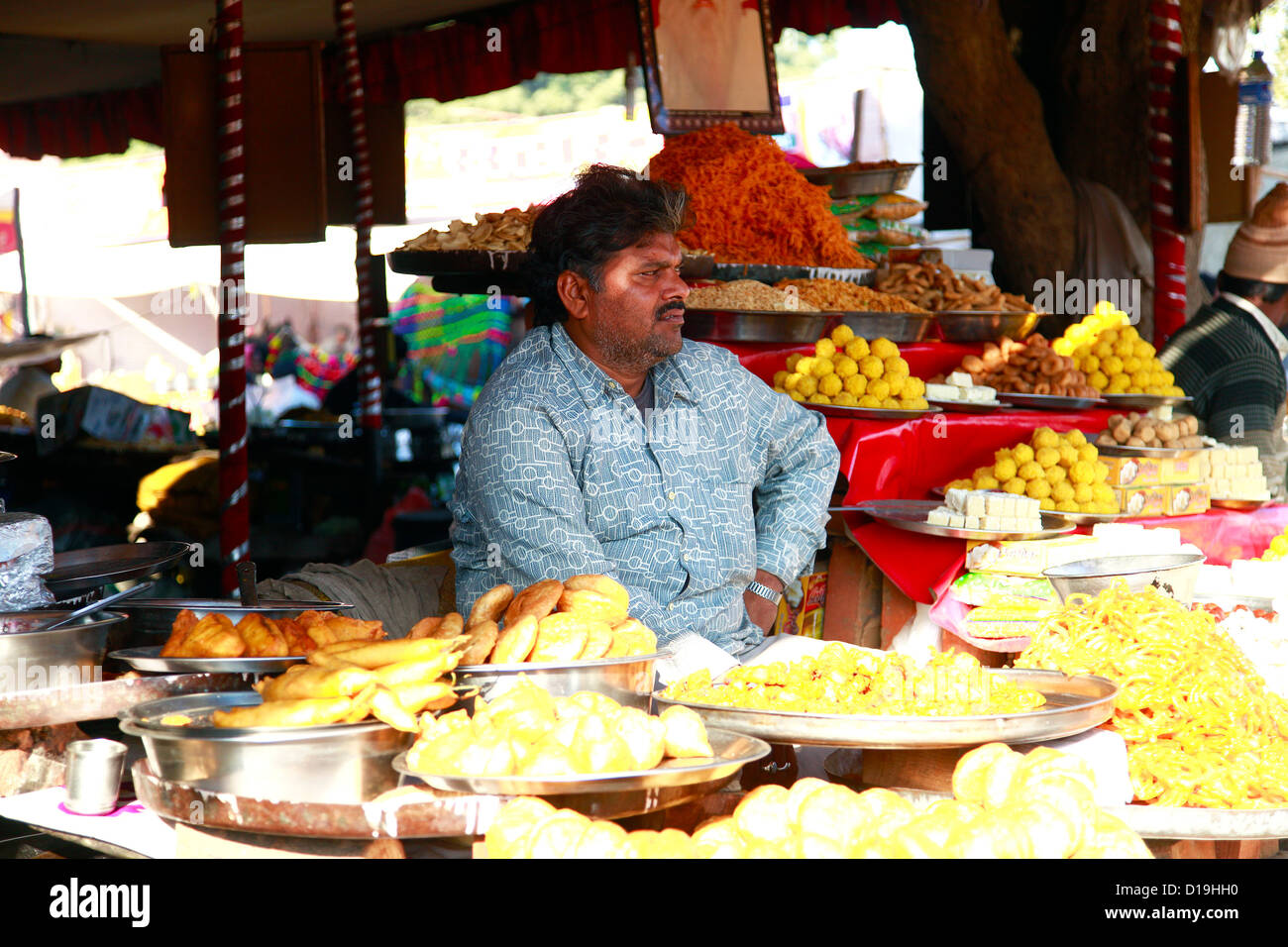 Indian street vendor selling sweets at Pushkar fair Stock Photo ...