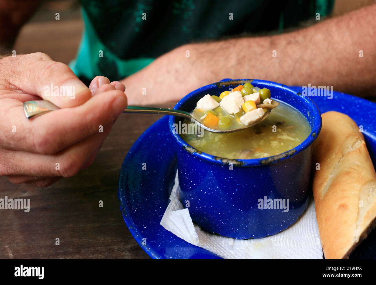 Vegetable soup in a dark blue cup Stock Photo - Alamy