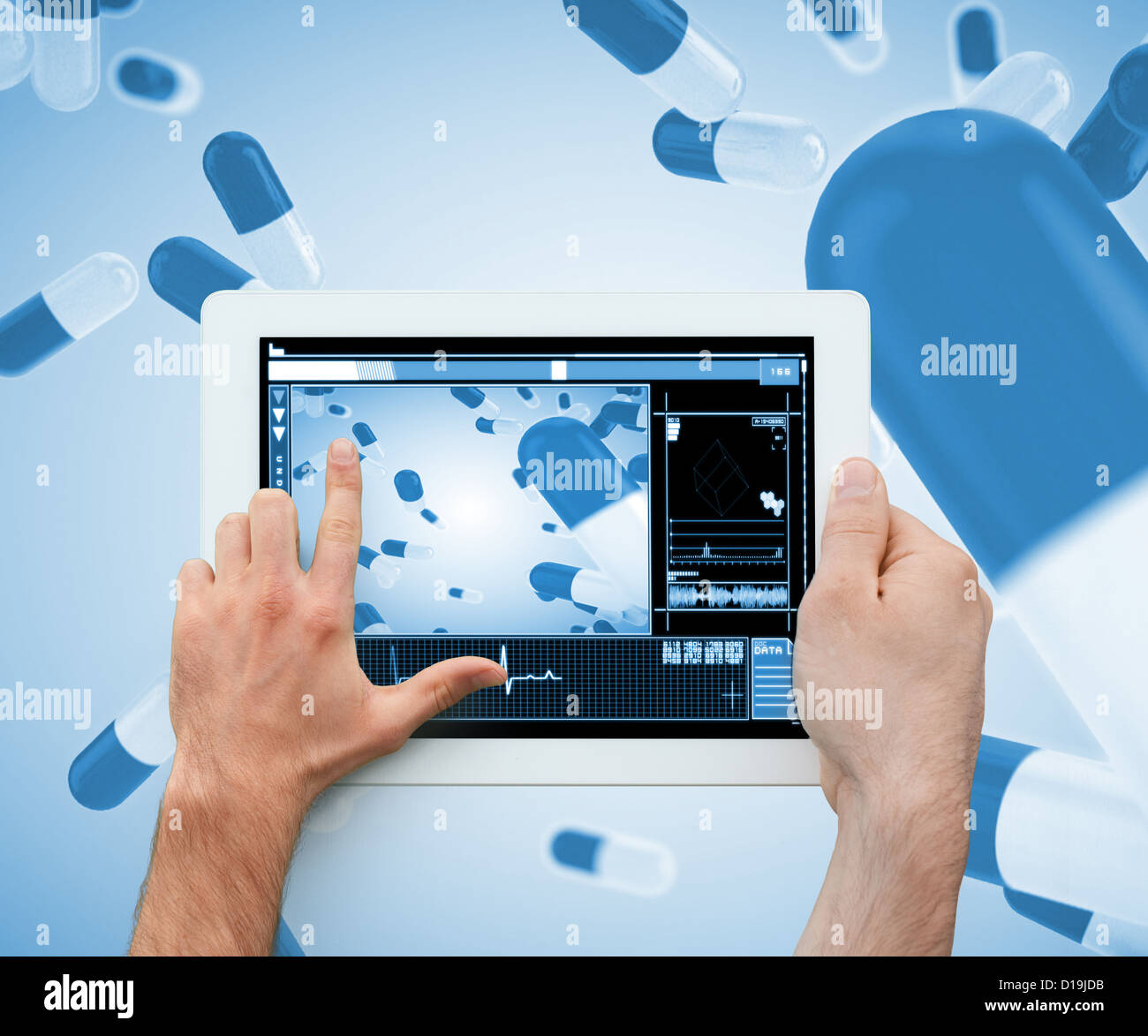 Hand holding and touching a digital tablet Stock Photo - Alamy