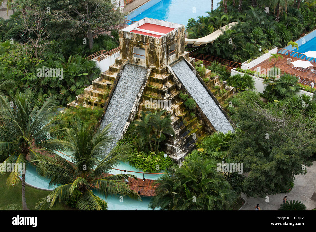 Myan Temple pyramid replica with waterfall and tropical plants, Mexico ...