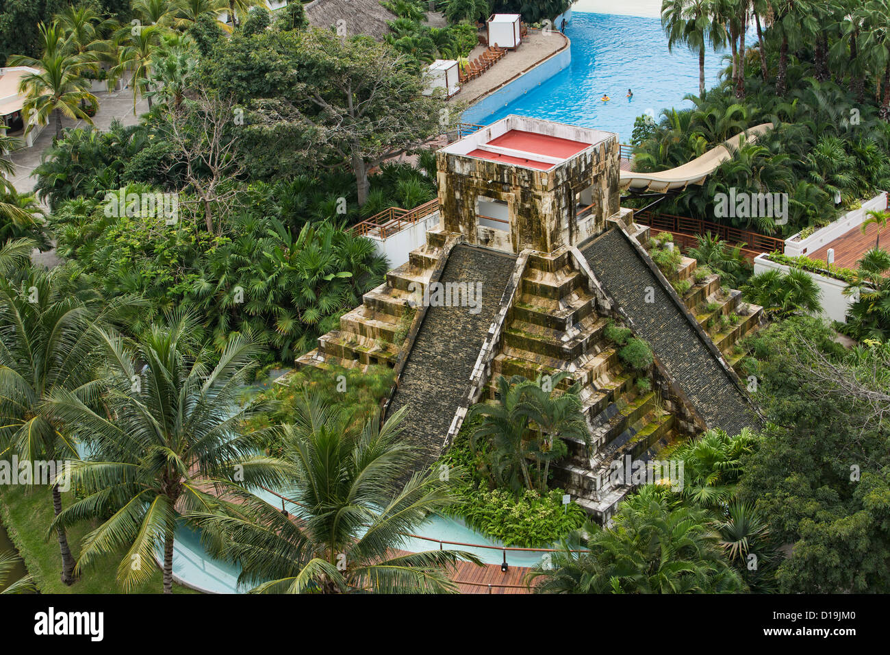 Myan Temple pyramid replica with waterfall and tropical plants, Mexico ...