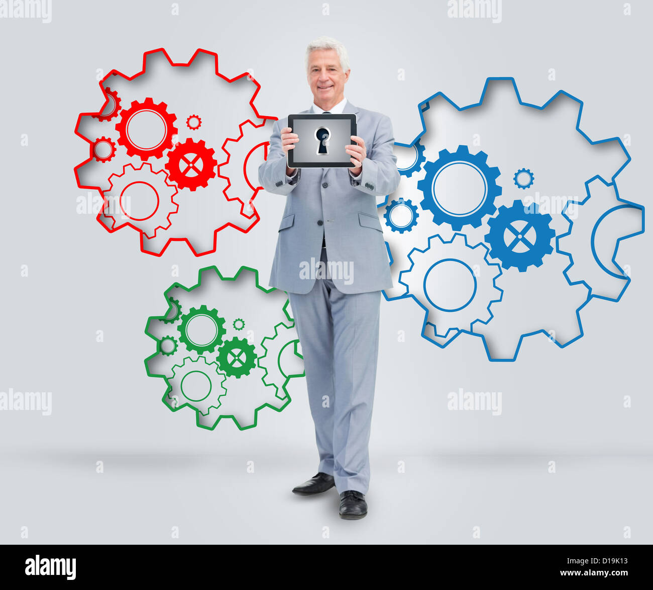 Mature business man presenting tablet Stock Photo - Alamy