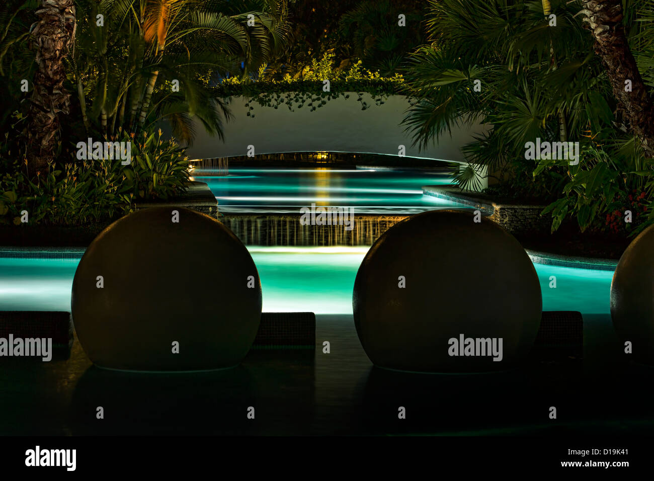 Tropical resort swimming pools at night with lights, Mexico Stock Photo ...