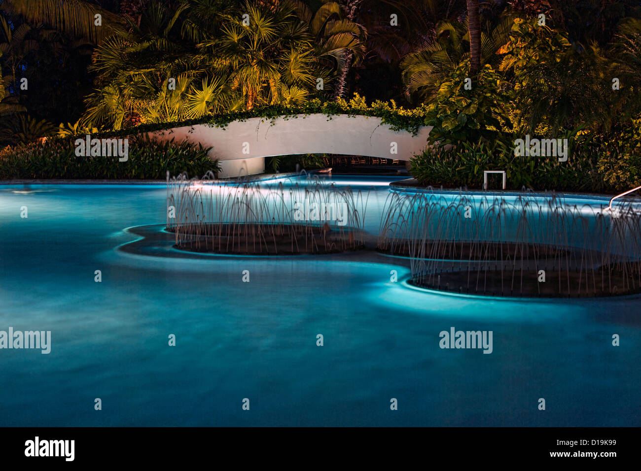 Tropical resort swimming pools at night with lights, Mexico Stock Photo ...