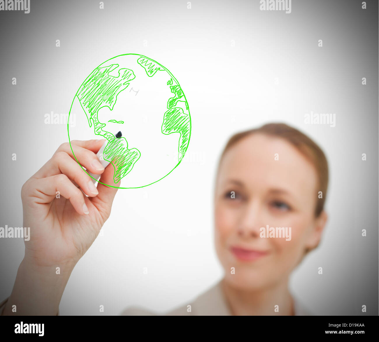 Woman drawing globe with marker Stock Photo - Alamy