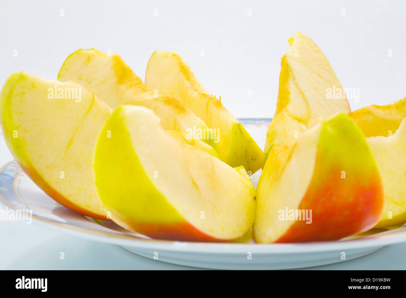 Close up of a quarters of apple fruit, isolated on white background ...