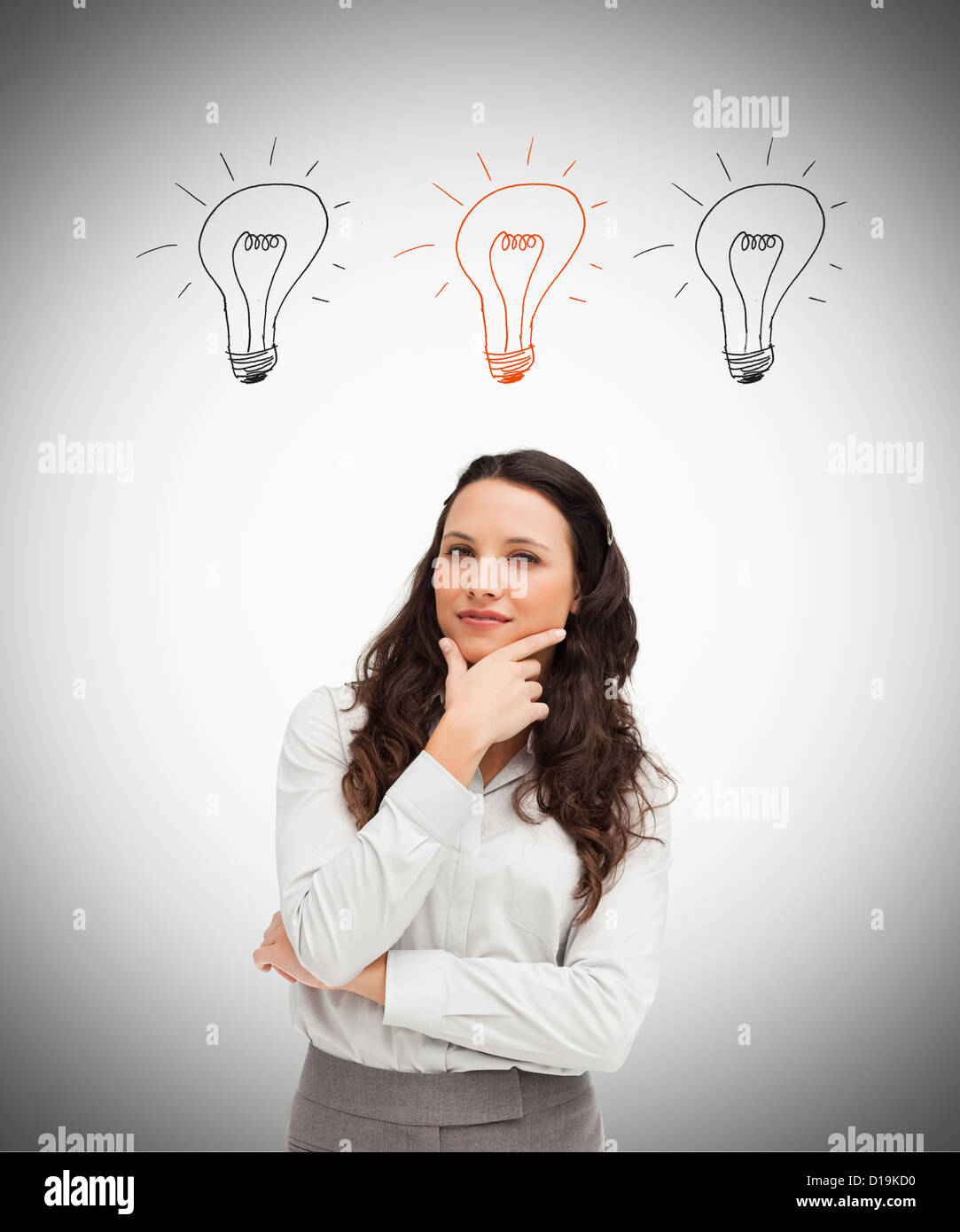 Thinking businesswoman standing against a background Stock Photo - Alamy