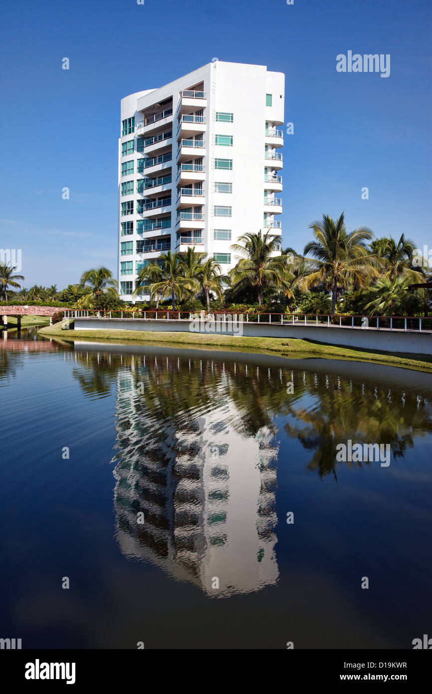 Resort hotel tower lake Mexico Stock Photo - Alamy