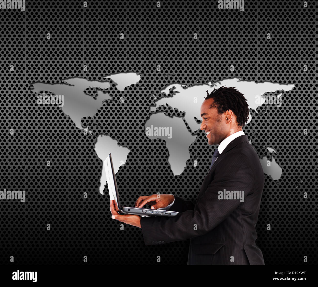 Smiling man in suit holding a laptop Stock Photo - Alamy