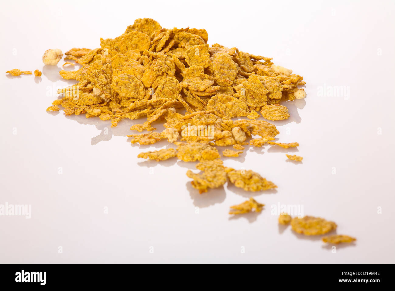 Close up of sweet cornflakes on white background Stock Photo - Alamy