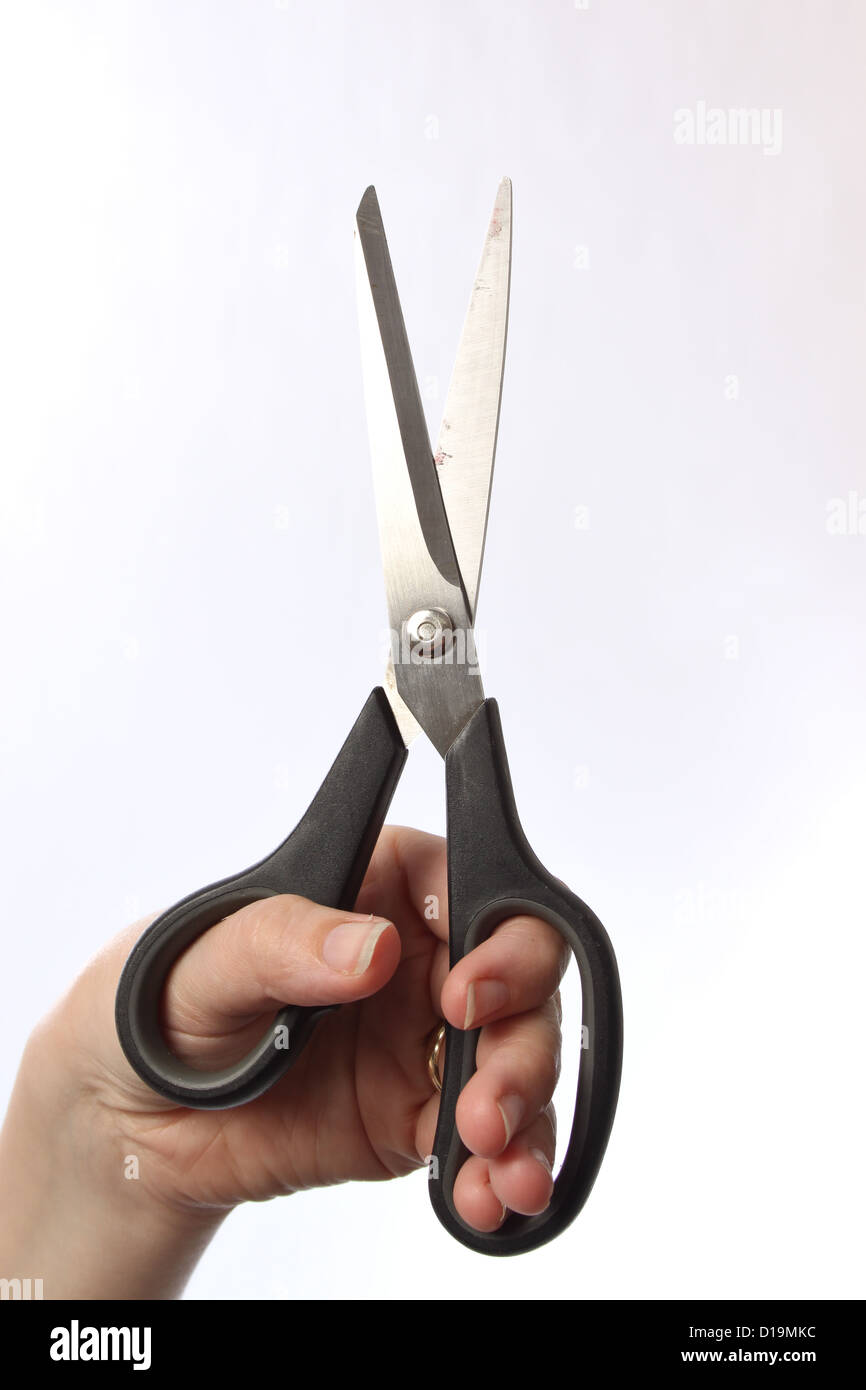 Hand holding scissors close up hi-res stock photography and images - Alamy