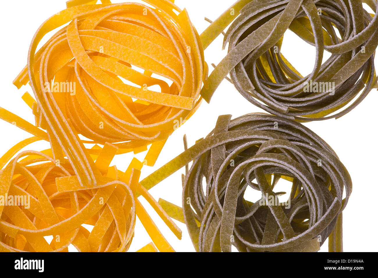 A raw colored pasta isolated on white background Stock Photo - Alamy