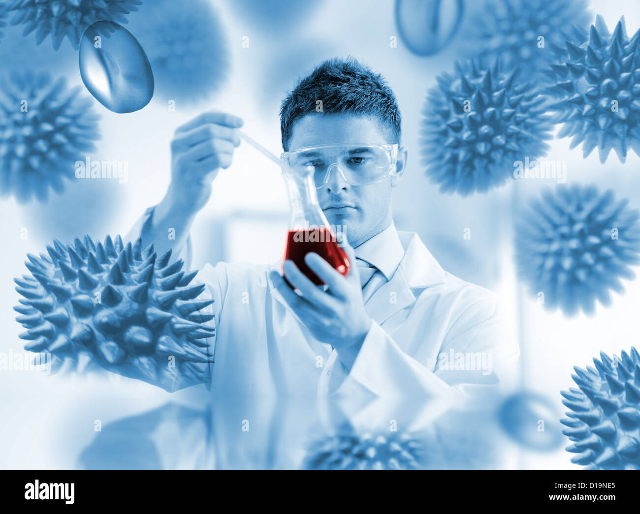 Serious chemist looking at beaker Stock Photo - Alamy