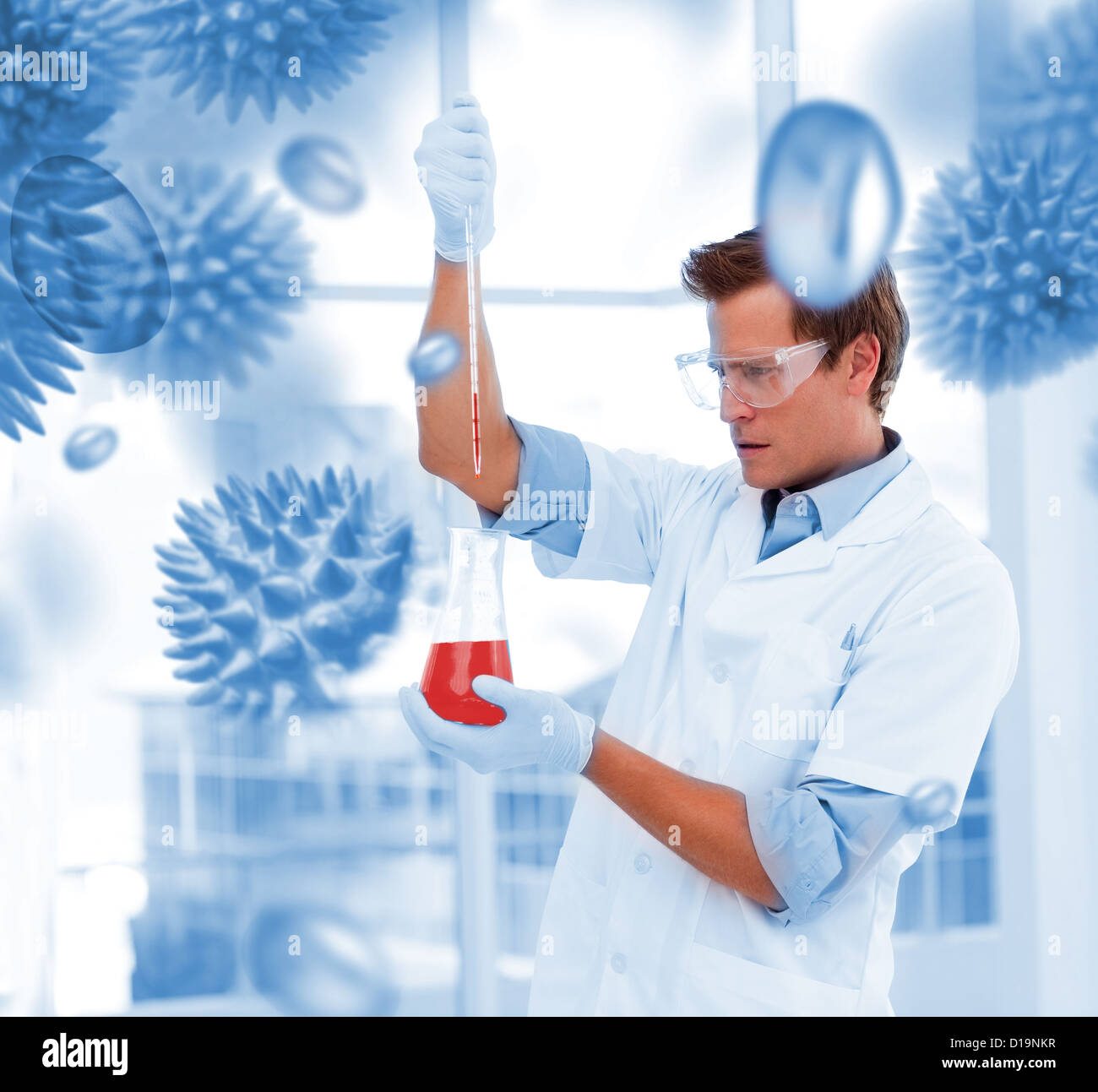 Young scientist pipetting a liquid in a test-tube Stock Photo - Alamy