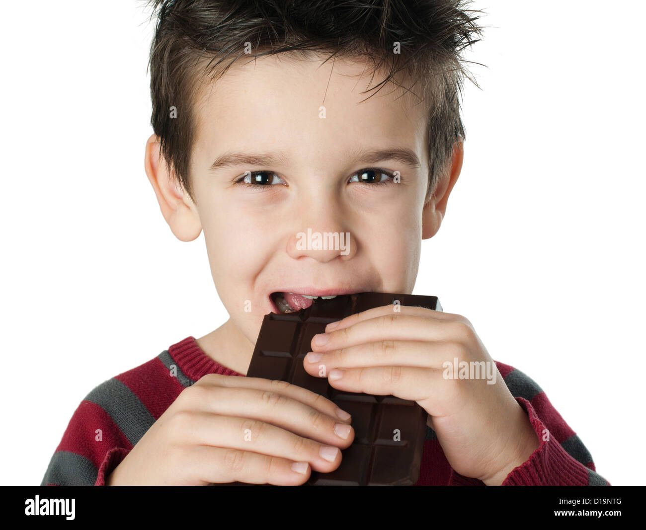 Smiling little boy eating chocolate. White isolated Stock Photo - Alamy