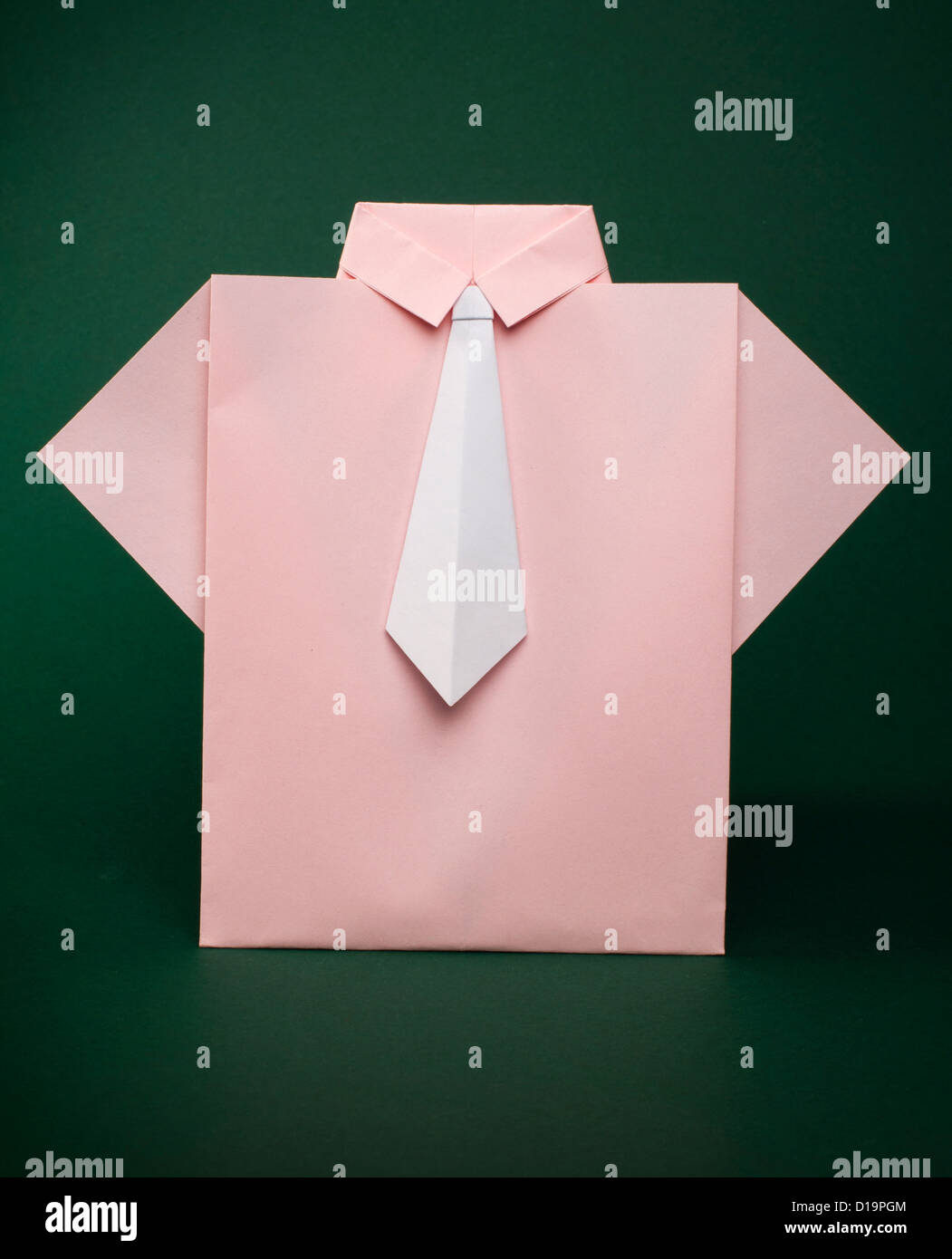 Isolated paper made pink shirt with white tie.Folded origami style ...