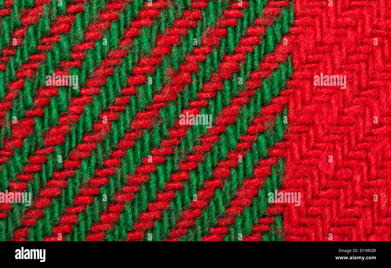 Handmade knit green and red background. Close up structure of the yarn ...