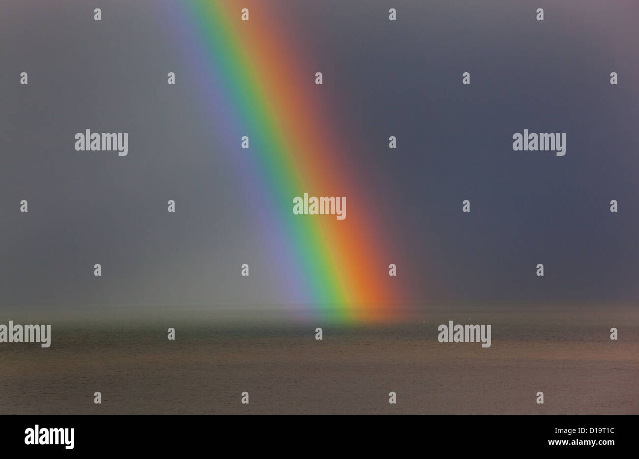 Rainbow off Weybourne Norfolk in rain storm Stock Photo - Alamy