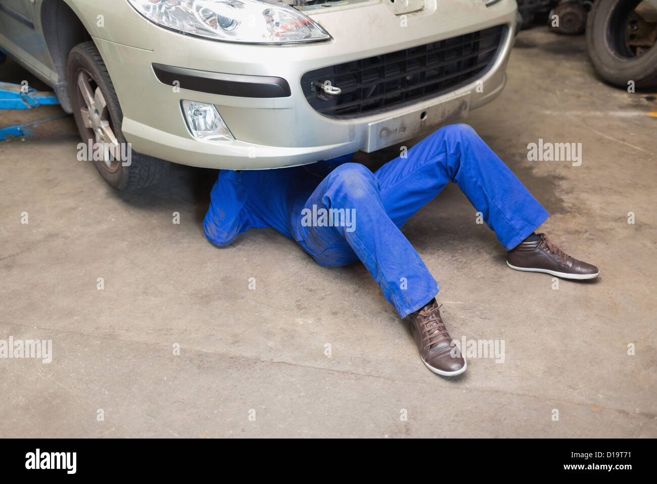 Mechanic under car hi-res stock photography and images - Alamy