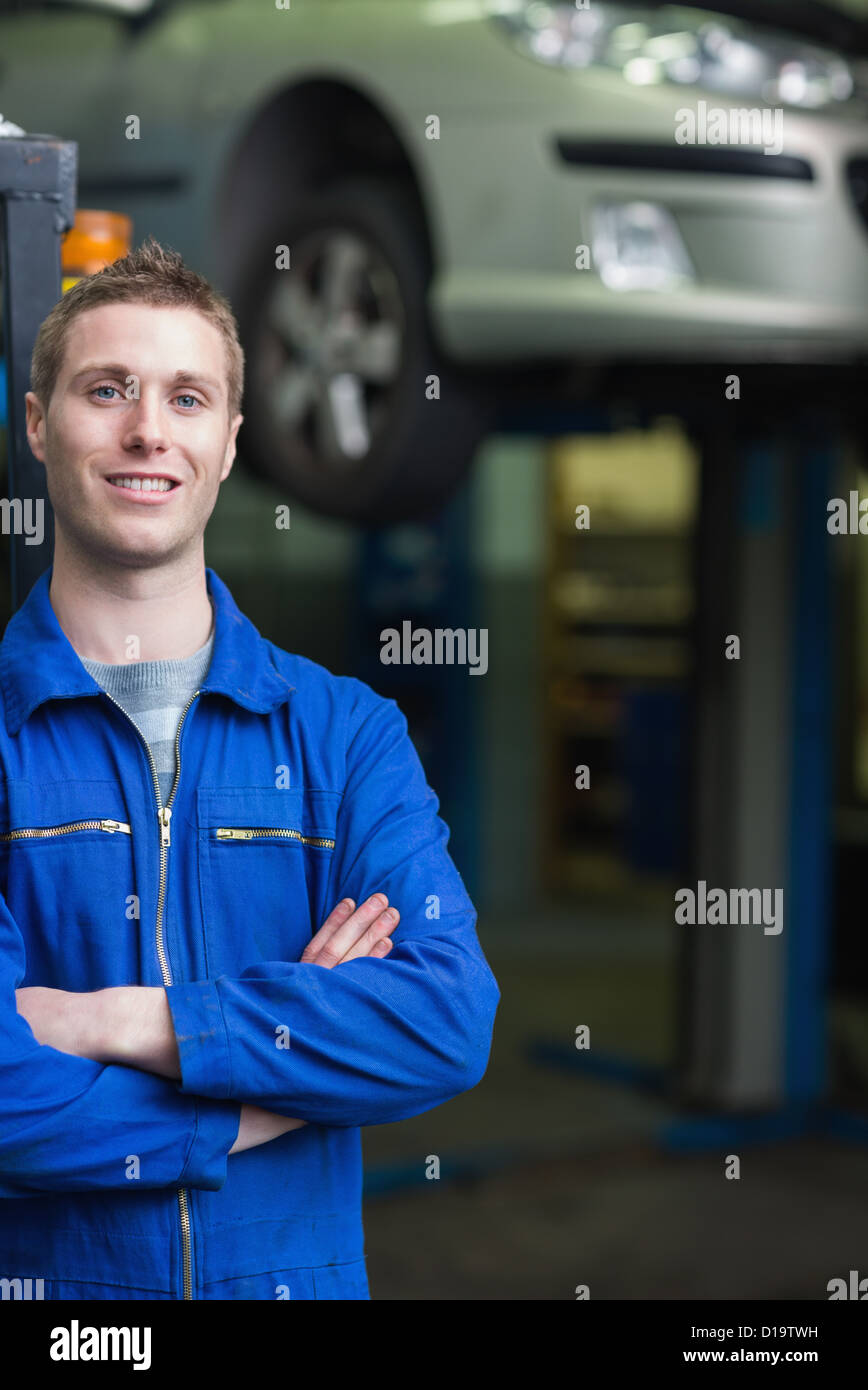 Smart car mechanic smiling Stock Photo - Alamy