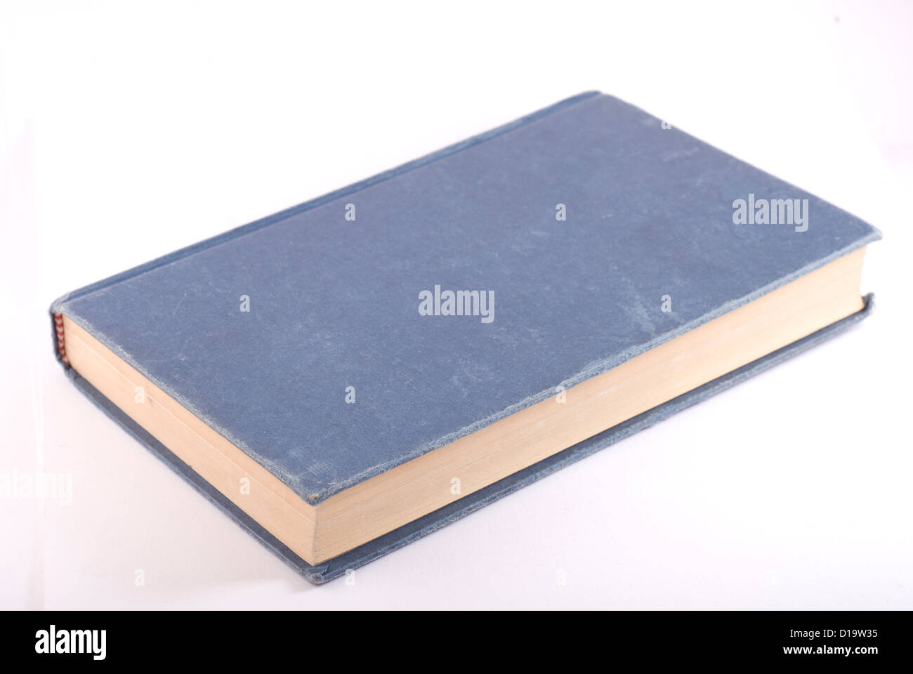 Old blue book isolated on white. Diagonal composition Stock Photo - Alamy