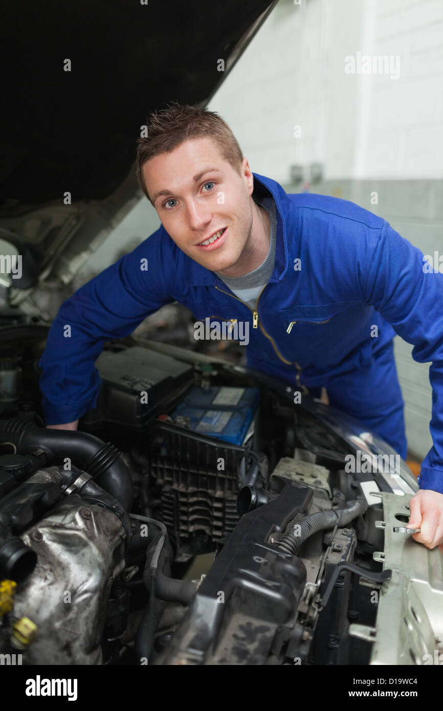 Male mechanic repairing car Stock Photo - Alamy