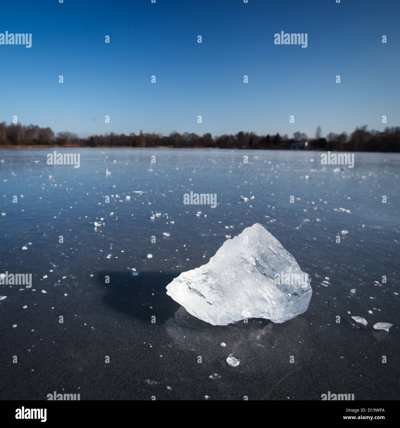 Freezing winter temperatures: block of ice lying on the surface of a ...