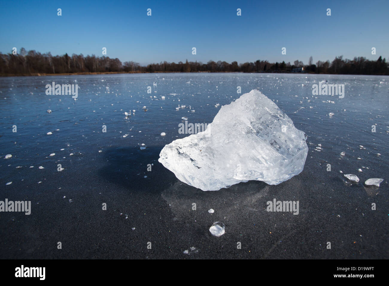 Freezing winter temperatures: block of ice lying on the surface of a ...