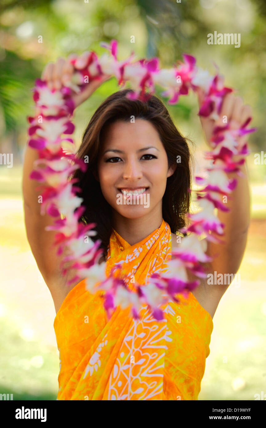 Hawaii, Oahu, Local Girl Wearing A Yellow Pareo Holds Out A Lei ...
