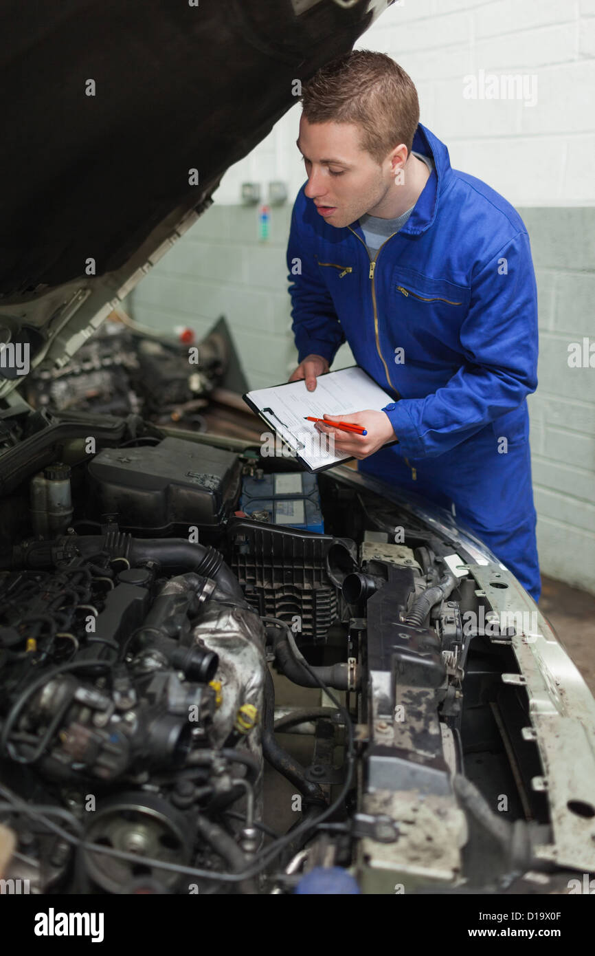 Car mechanic preparing checklist Stock Photo - Alamy