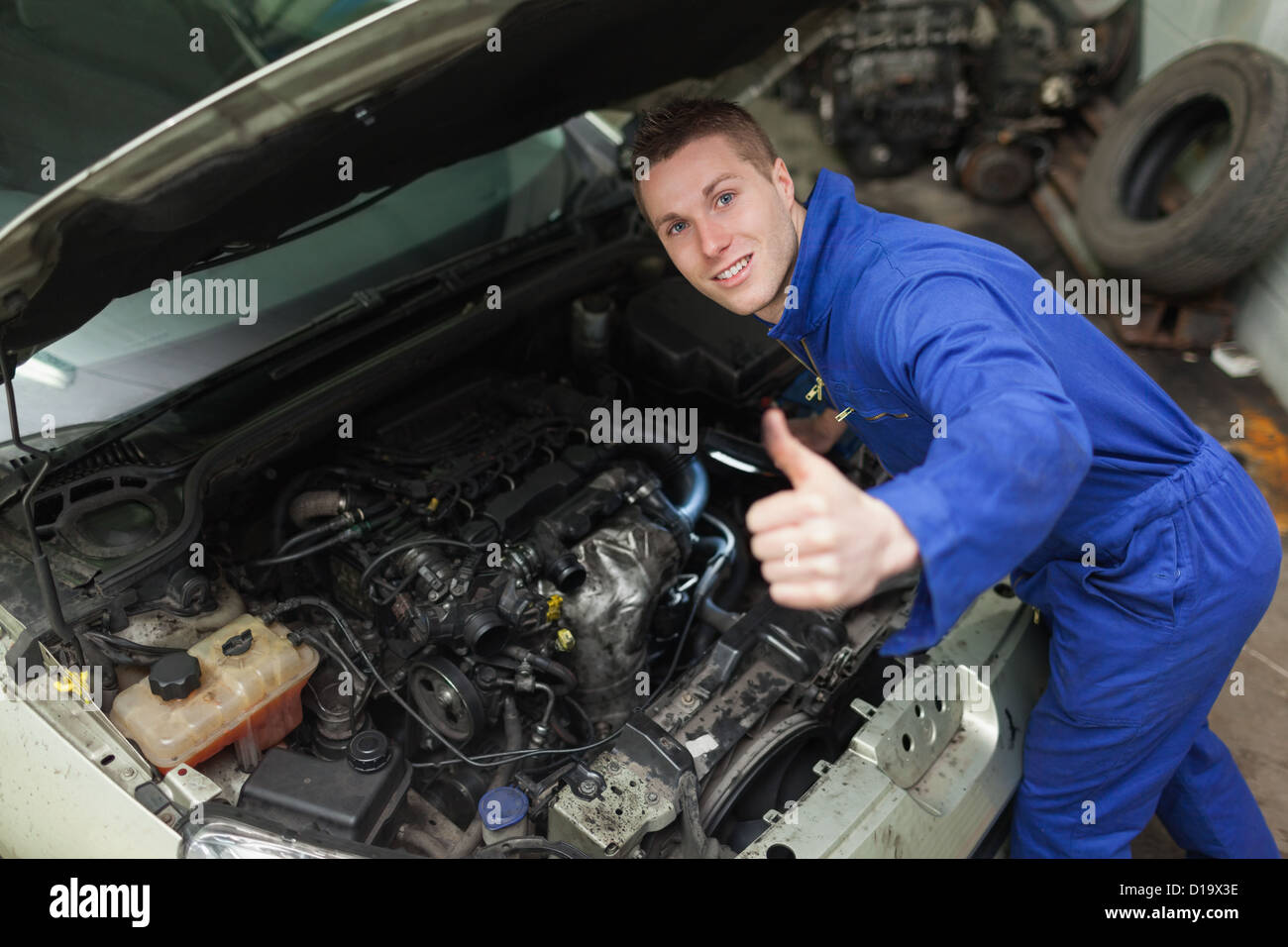 Car mechanic gesturing thumbs up Stock Photo - Alamy