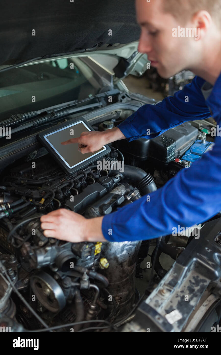 Mechanic tablet pc repairing car hi-res stock photography and images ...