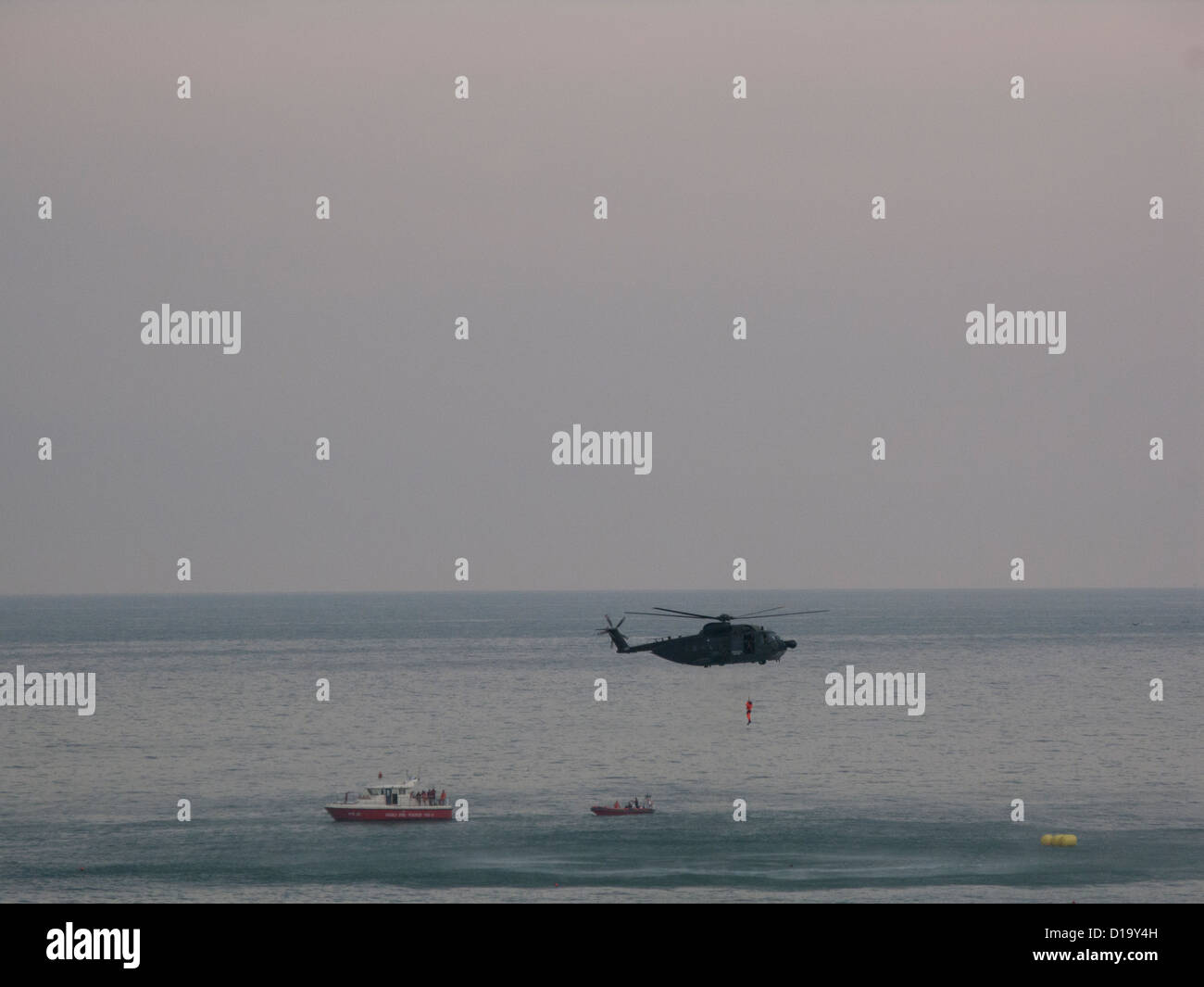 helicopter rescuing people at sea Stock Photo - Alamy