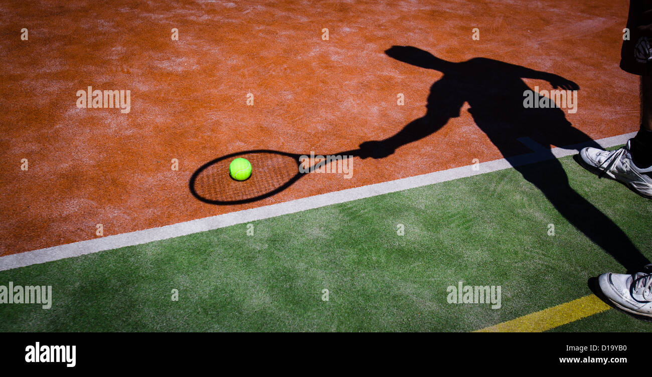 shadow of a tennis player in action on a tennis court Stock Photo - Alamy
