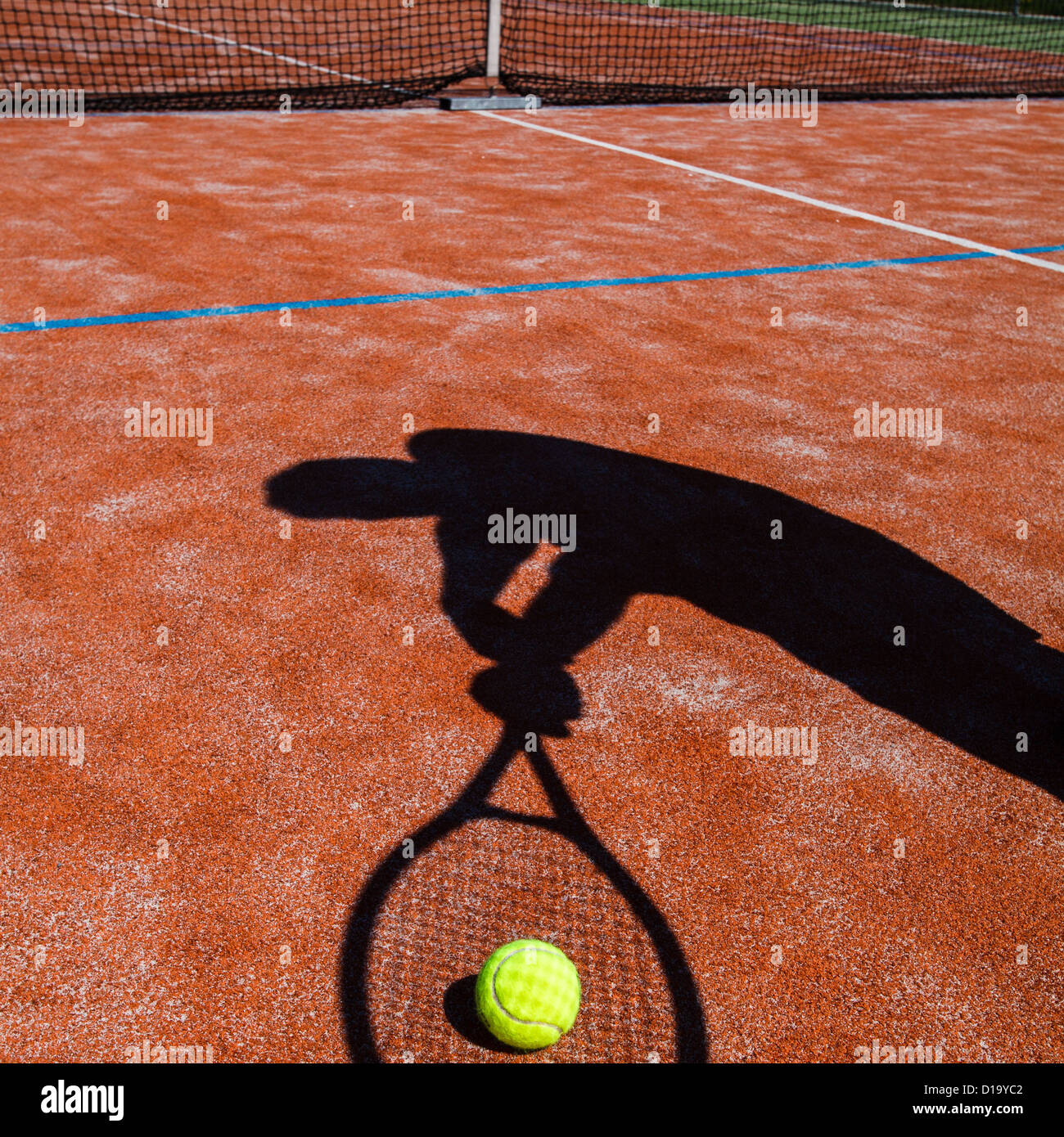 shadow of a tennis player in action on a tennis court Stock Photo - Alamy