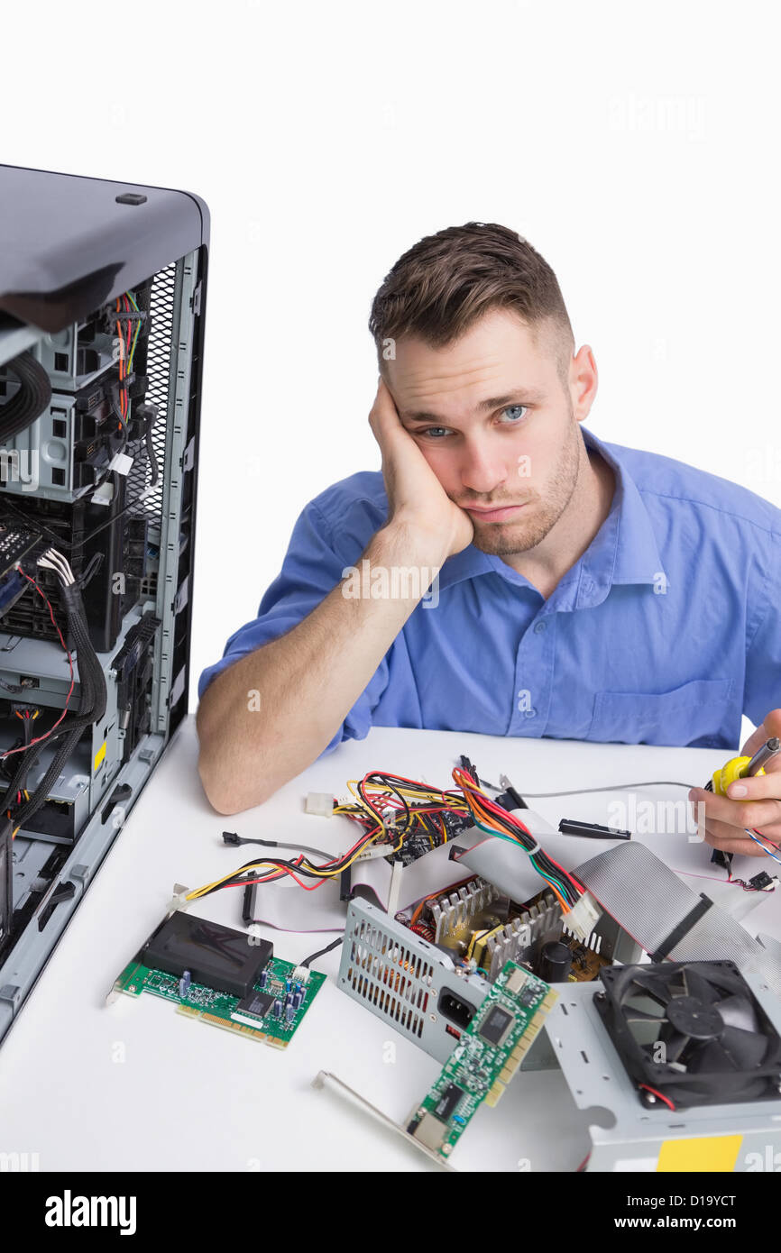 Portrait of young tired computer engineer with cpu parts Stock Photo ...