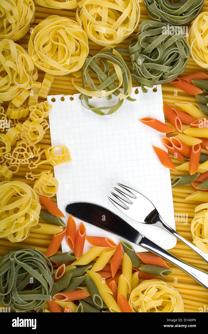 Note paper on various Italian pasta background and silverware Stock ...